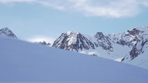 Snow mountain range summit on sunny wint... | Stock Video | Pond5