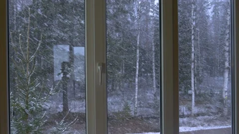 Snow outside the window, forest backgrou... | Stock Video | Pond5