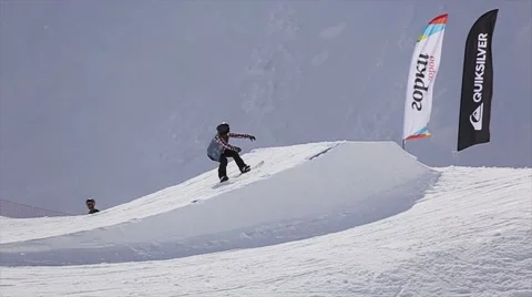 Snowboarders high jump from springboard.... | Stock Video | Pond5