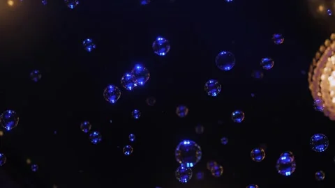 Soap balloons floating in the air at a p... | Stock Video | Pond5