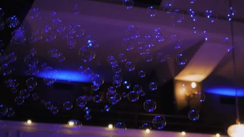Soap balloons floating in the air at a p... | Stock Video | Pond5