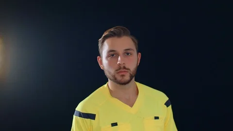 Soccer referee on black background showi... | Stock Video | Pond5