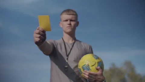 Soccer referee with yellow card warning ... | Stock Video | Pond5