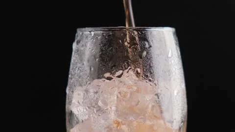 Soda fizzy cold drink in a glass with ic... | Stock Video | Pond5