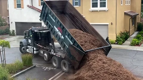 Soil dump truck tipping soil onto drivew... | Stock Video | Pond5
