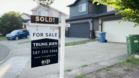 A "SOLD!" sign stands proudly in front o... | Stock Video | Pond5