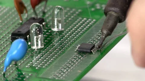 Soldering surface mount IC to circuit by... | Stock Video | Pond5