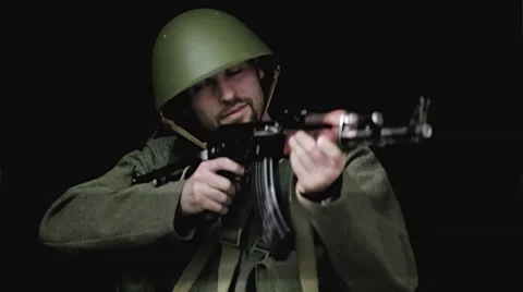 A soldier is aiming with a kalashnikov A... | Stock Video | Pond5
