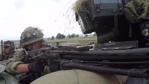 Soldier aiming machine gun from armoured... | Stock Video | Pond5