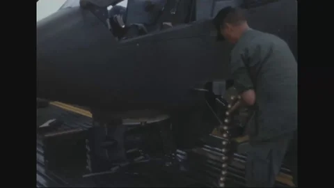 Soldier and instructor pilot load 40mm g... | Stock Video | Pond5