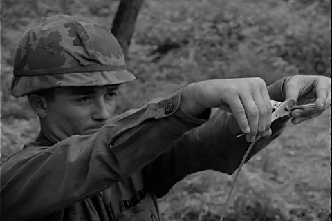 Soldier attaches blasting cap to detonat... | Stock Video | Pond5