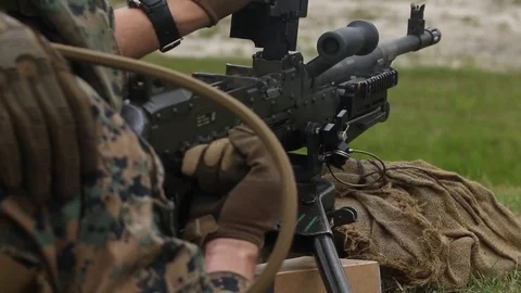 Soldier cleaning machine gun during fiel... | Stock Video | Pond5
