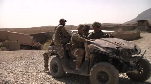 Soldier Drive With a ATV Quad In Camp | Stock Video | Pond5