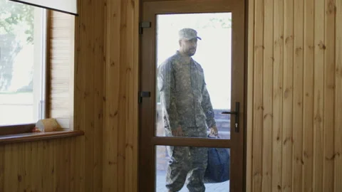 Soldier entering home with happy family | Stock Video | Pond5