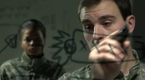 Soldier explaining a plan of action to a... | Stock Video | Pond5