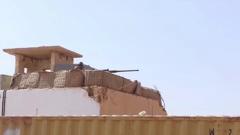 Soldier firing machine gun from hideout ... | Stock Video | Pond5