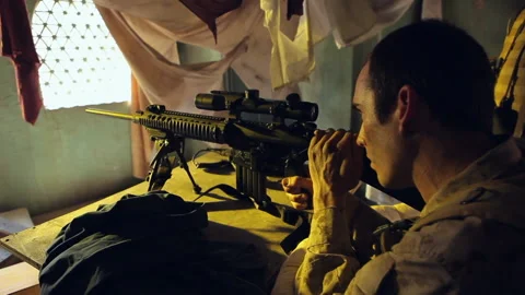 Soldier looking through rifle scope in r... | Stock Video | Pond5