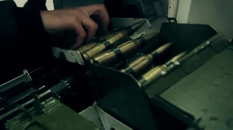 Soldier reloading heavy machine gun | Stock Video | Pond5