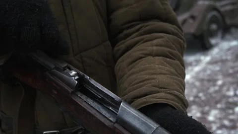 a soldier reloads a rifle, a sniper load... | Stock Video | Pond5