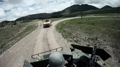 Soldier shoots humvee machine gun while ... | Stock Video | Pond5