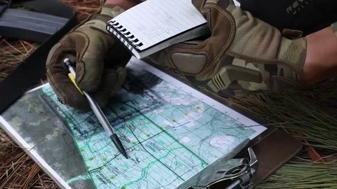 Soldier studying map during land navigat... | Stock Video | Pond5