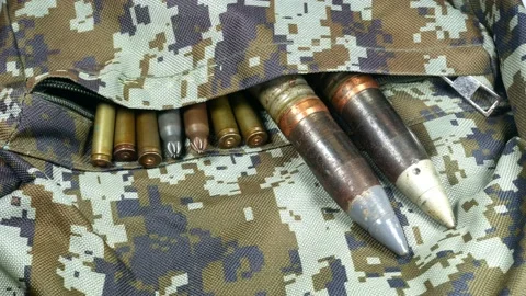 Soldier takes Bullets, shells, cartridge... | Stock Video | Pond5