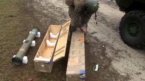 Soldier unpacking missiles from wooden a... | Stock Video | Pond5