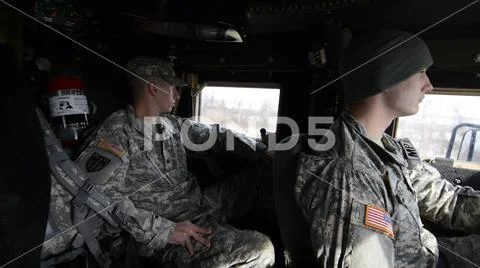 Photograph: Soldiers from the 1137th MP Company drive on the levee in a ...