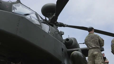 Soldiers and Apache attack helicopter ch... | Stock Video | Pond5