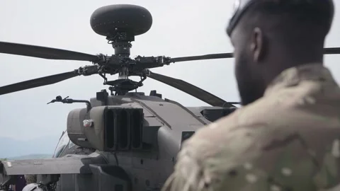 Soldiers and Apache attack helicopter ch... | Stock Video | Pond5