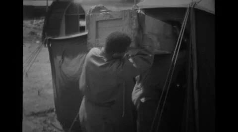 Soldiers carrying boxes inside the tent | Stock Video | Pond5