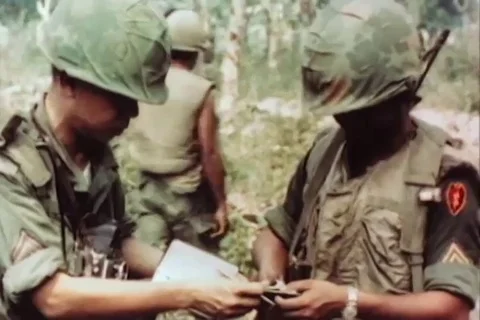 Soldiers check captured documents and we... | Stock Video | Pond5