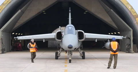 Soldiers check military jet in front of ... | Stock Video | Pond5