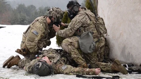 Soldiers cover body of dead soldier duri... | Stock Video | Pond5