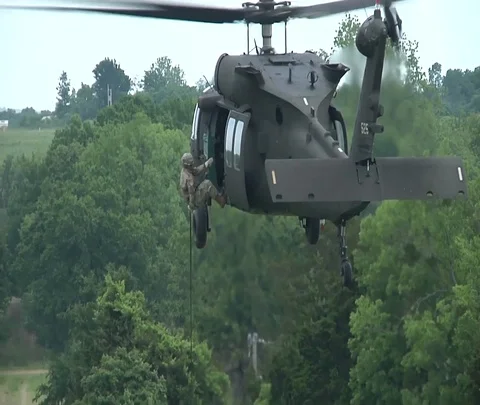 Soldiers fast roping from UH-60 Black Ha... | Stock Video | Pond5