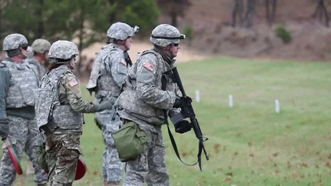 Soldiers firing rifles at firing range | Stock Video | Pond5