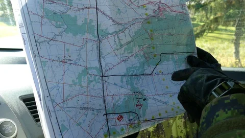 Soldier's hands with gloves point at map... | Stock Video | Pond5