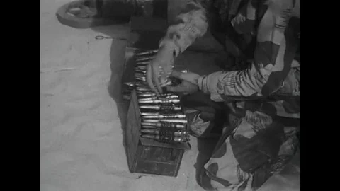 Soldiers load ammo into a heavy machine ... | Stock Video | Pond5
