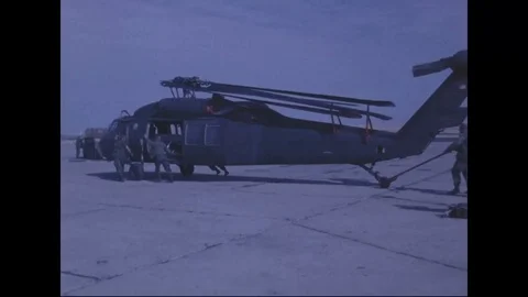 Soldiers load the UH-60 Black Hawk copte... | Stock Video | Pond5