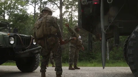 Soldiers positioning towbar to military ... | Stock Video | Pond5