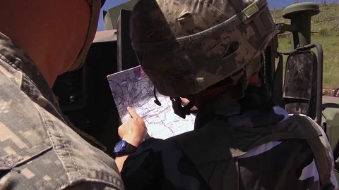 Soldiers reading map during live fire ex... | Stock Video | Pond5