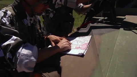 Soldiers reading map | Stock Video | Pond5