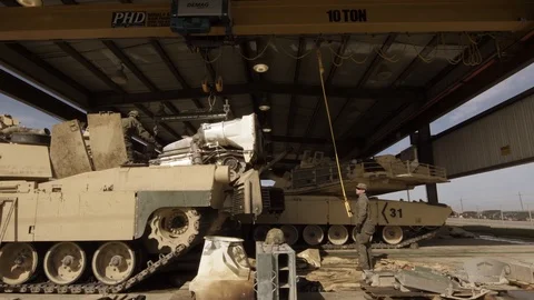 Soldiers removing an Abrams tank engine ... | Stock Video | Pond5