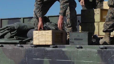 Soldiers unloading wooden crates of ammu... | Stock Video | Pond5