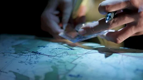 Soldiers using compass on map | Stock Video | Pond5