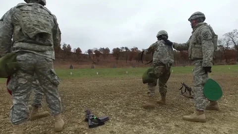 Soliders firing with rifles while traini... | Stock Video | Pond5