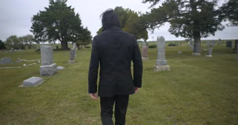 Man Walking In Cemetery Stock Footage ~ Royalty Free Stock Videos | Pond5