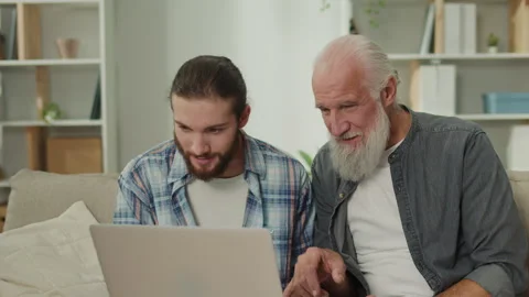 Son introducing dad to digital world, us... | Stock Video | Pond5