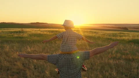 Son, kid, sits on his fathers neck, play... | Stock Video | Pond5