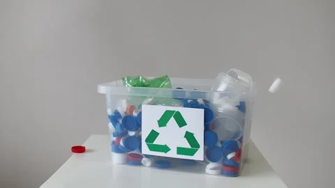 Sorting plastic bottle caps and lids rec... | Stock Video | Pond5